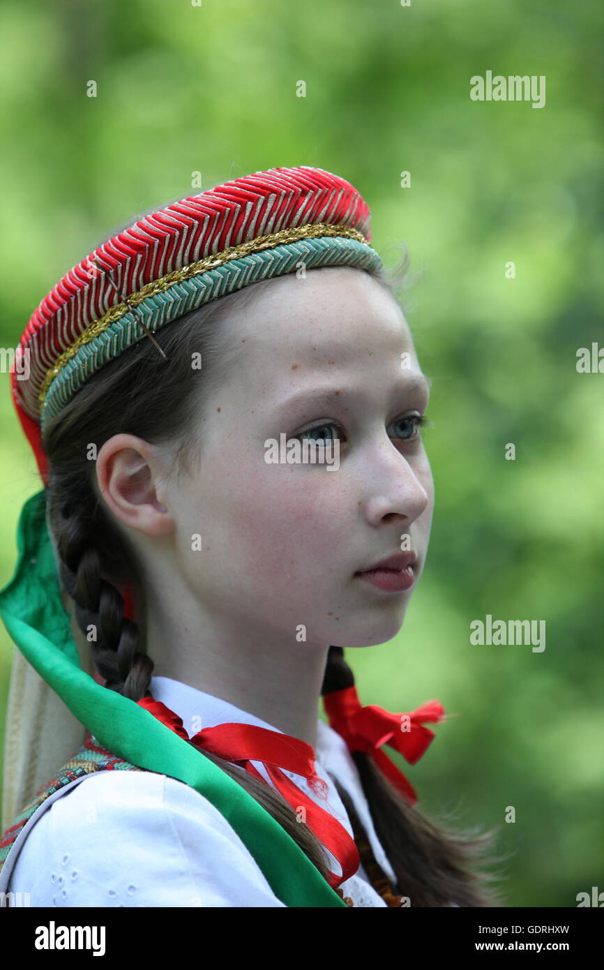 a Women in traditional dress on a Summer Festival in a Parc in the old ...