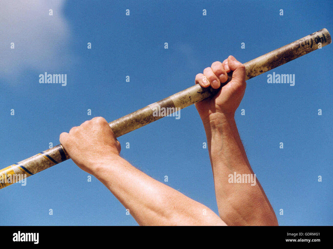Pole vaulter holding his rod Stock Photo - Alamy