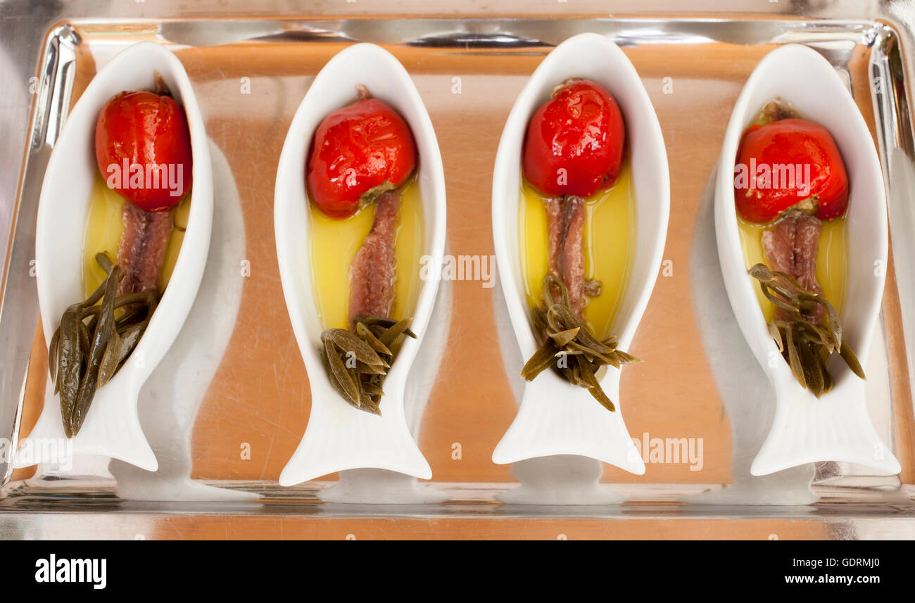 Salted anchovy fillets with Mediterranean spices and herbs Stock Photo ...