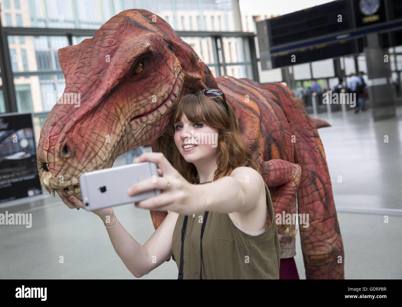 EDITORIAL USE ONLY Megan Webb, from Surrey, takes a selfie with a model ...
