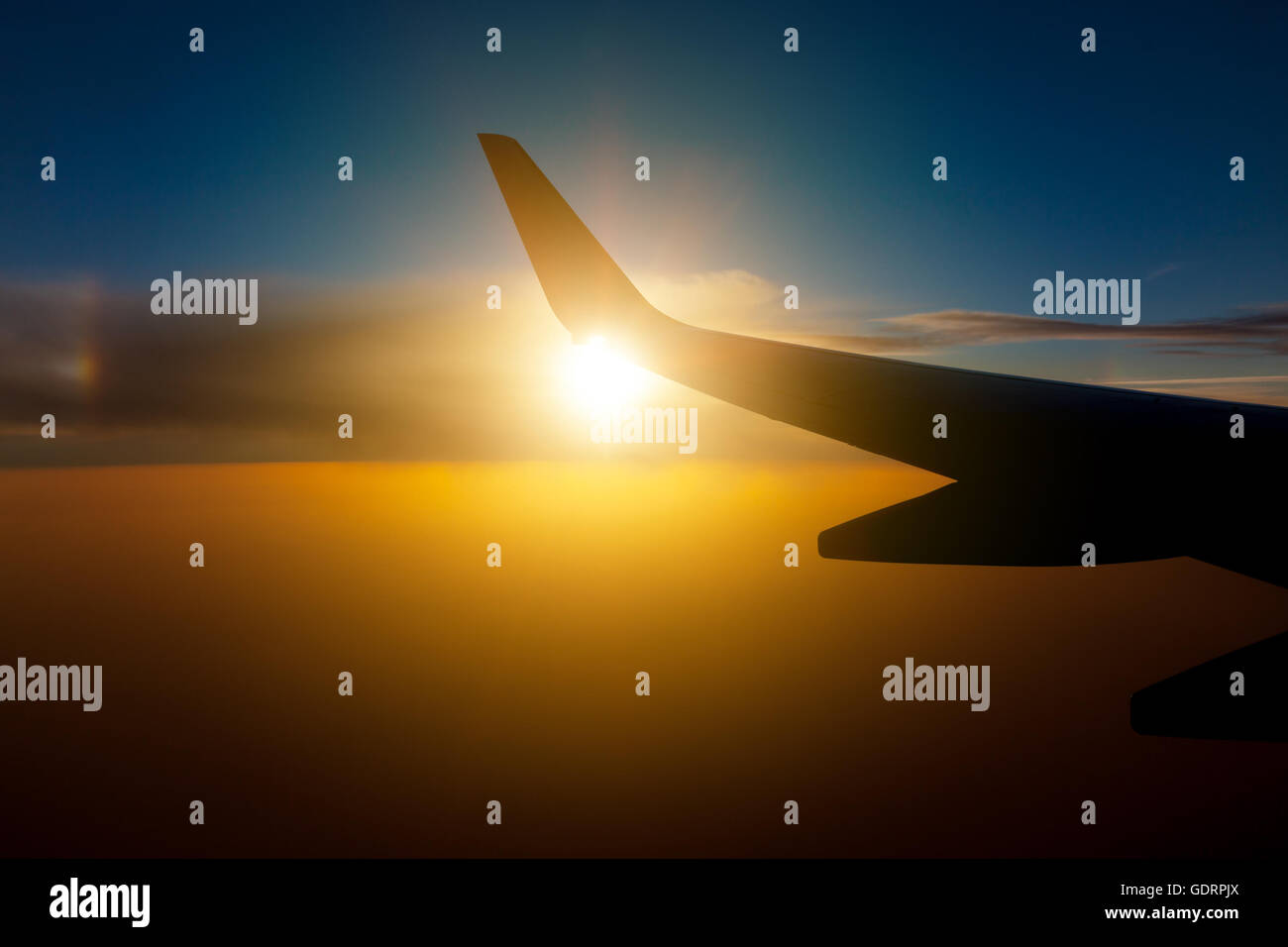 Wing aircraft at sunset Stock Photo - Alamy