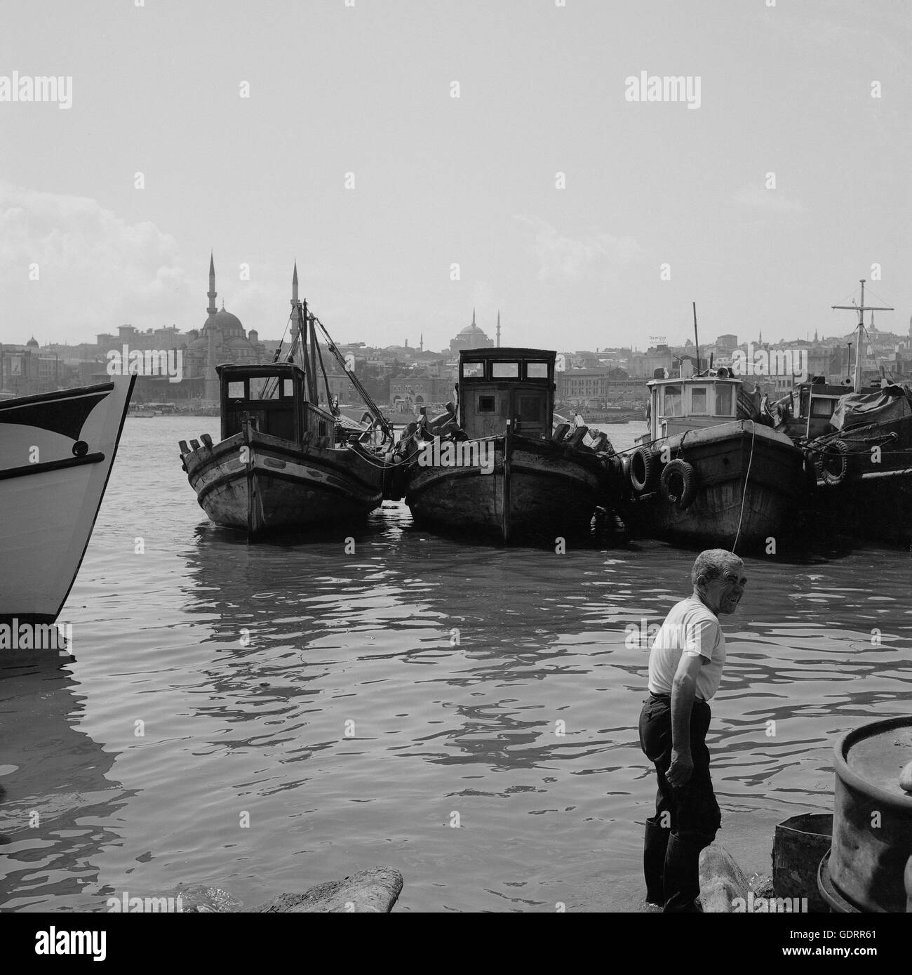 Man fishing in port Black and White Stock Photos & Images - Alamy