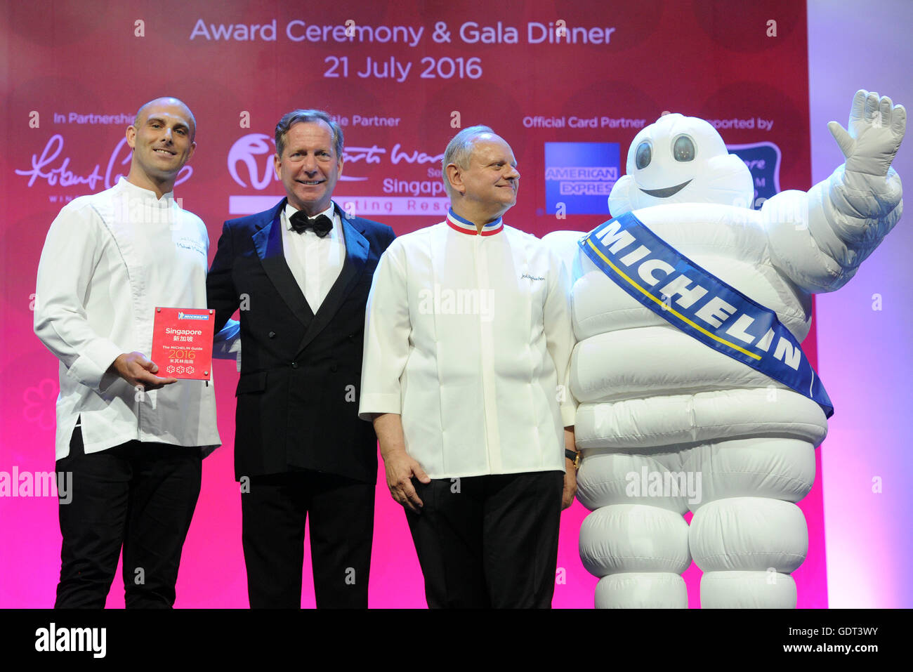Singapore, French chefs Joel Robuchon (2nd R) and Michael Michaelidis ...