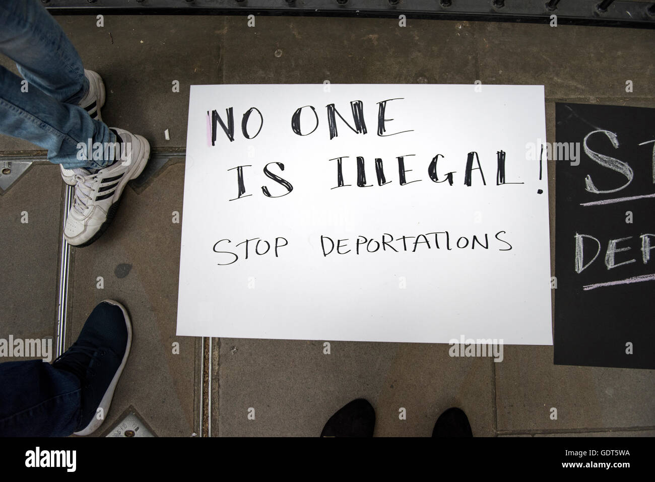 London, UK. 21st July 2016. A poster on the floor reading: "No One Is ...