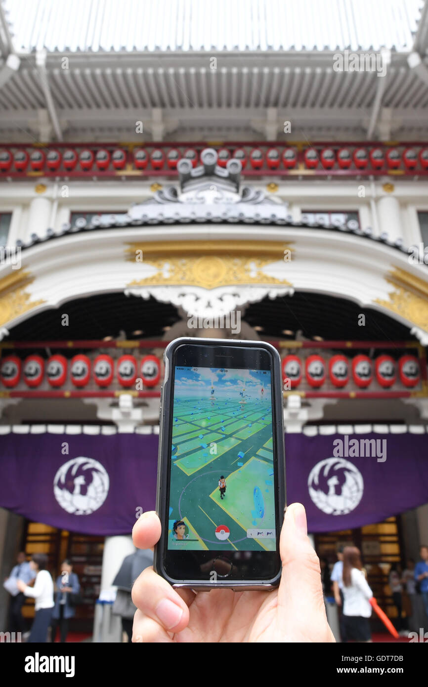 Fans try out Pokemon Go in Tokyo's Ginza district on July 22, 2016 ...