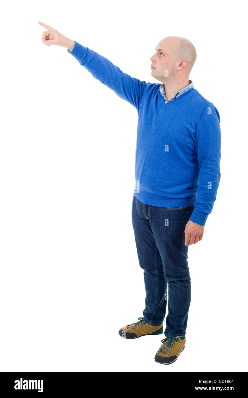 young casual man full body, pointing, isolated on a white background ...