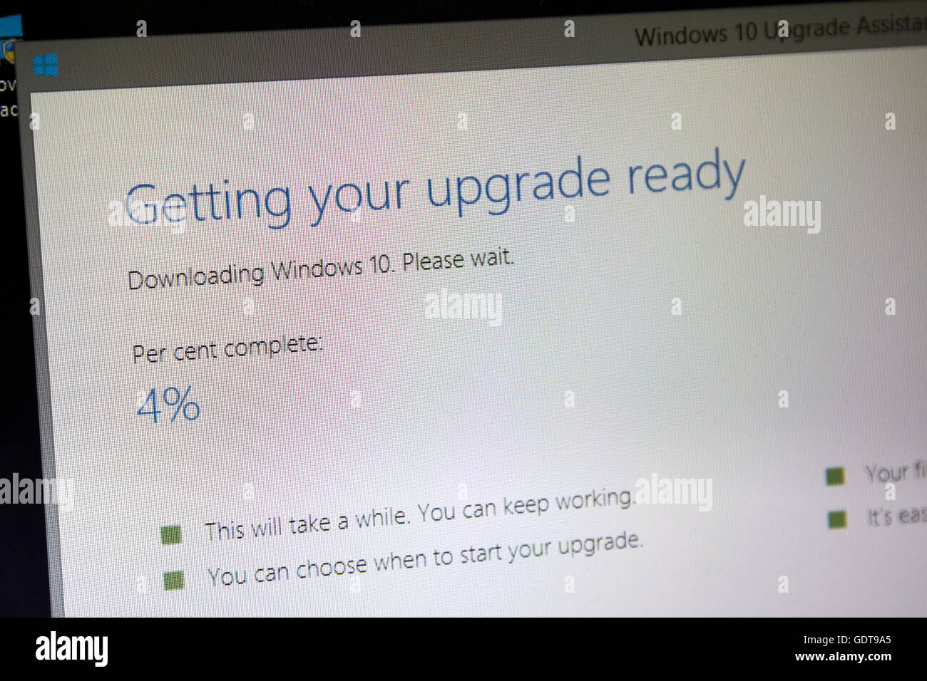 computer showing downloading windows 10 upgrade screen Stock Photo - Alamy