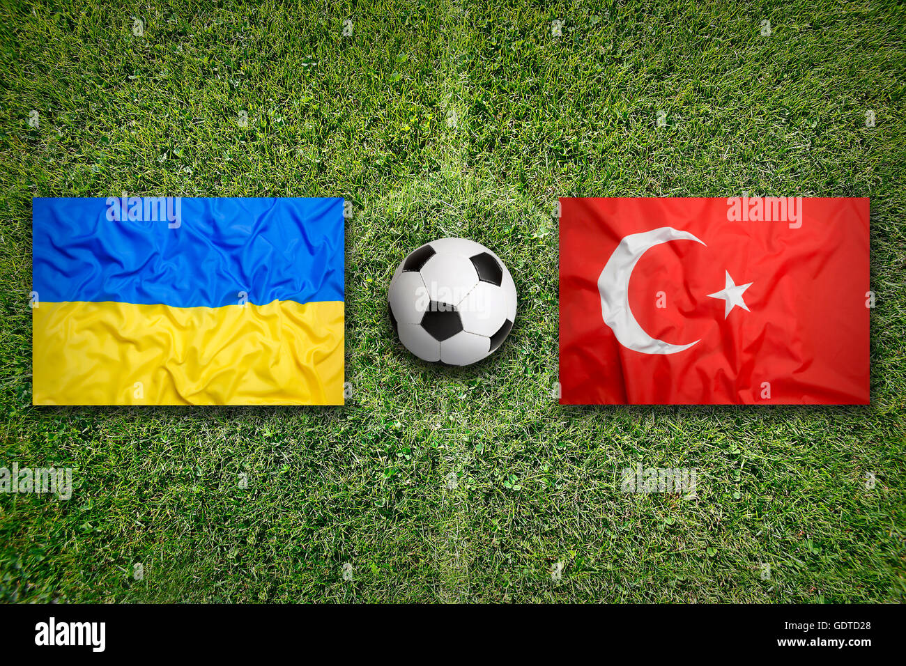 Ukraine vs. Turkey flags on green soccer field Stock Photo - Alamy