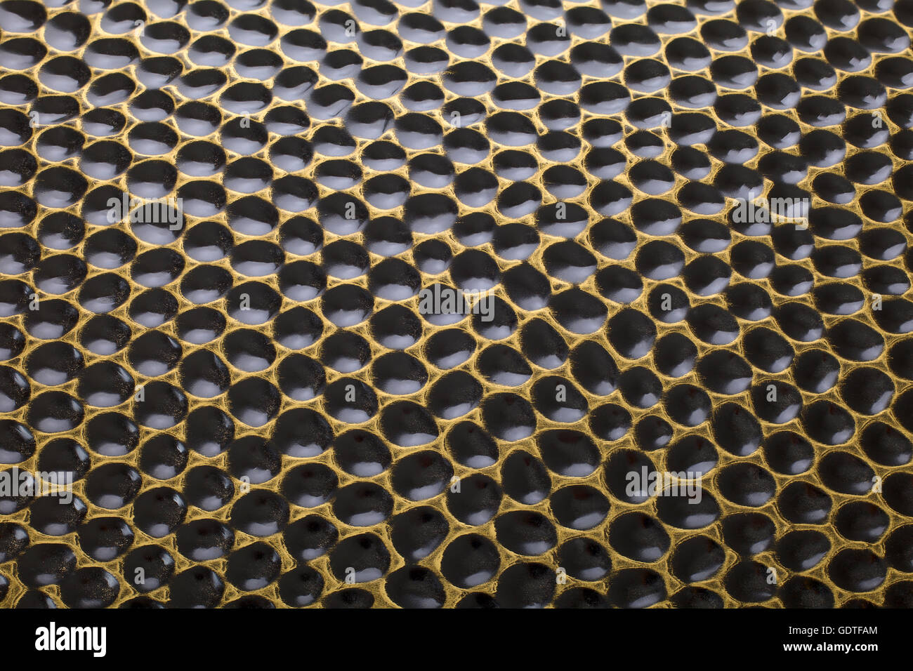 Black - yellow pressed steel plate as background , focus fusion Stock ...