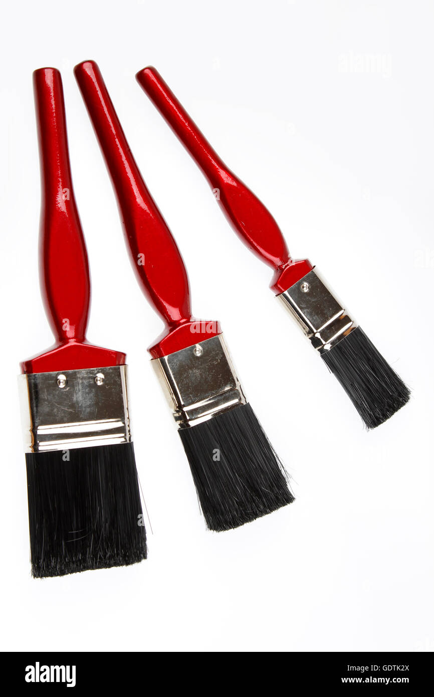 Three paintbrushes isolated on plain background Stock Photo - Alamy