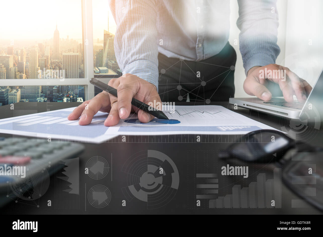 Double exposure of businessman hand working with new modern computer ...
