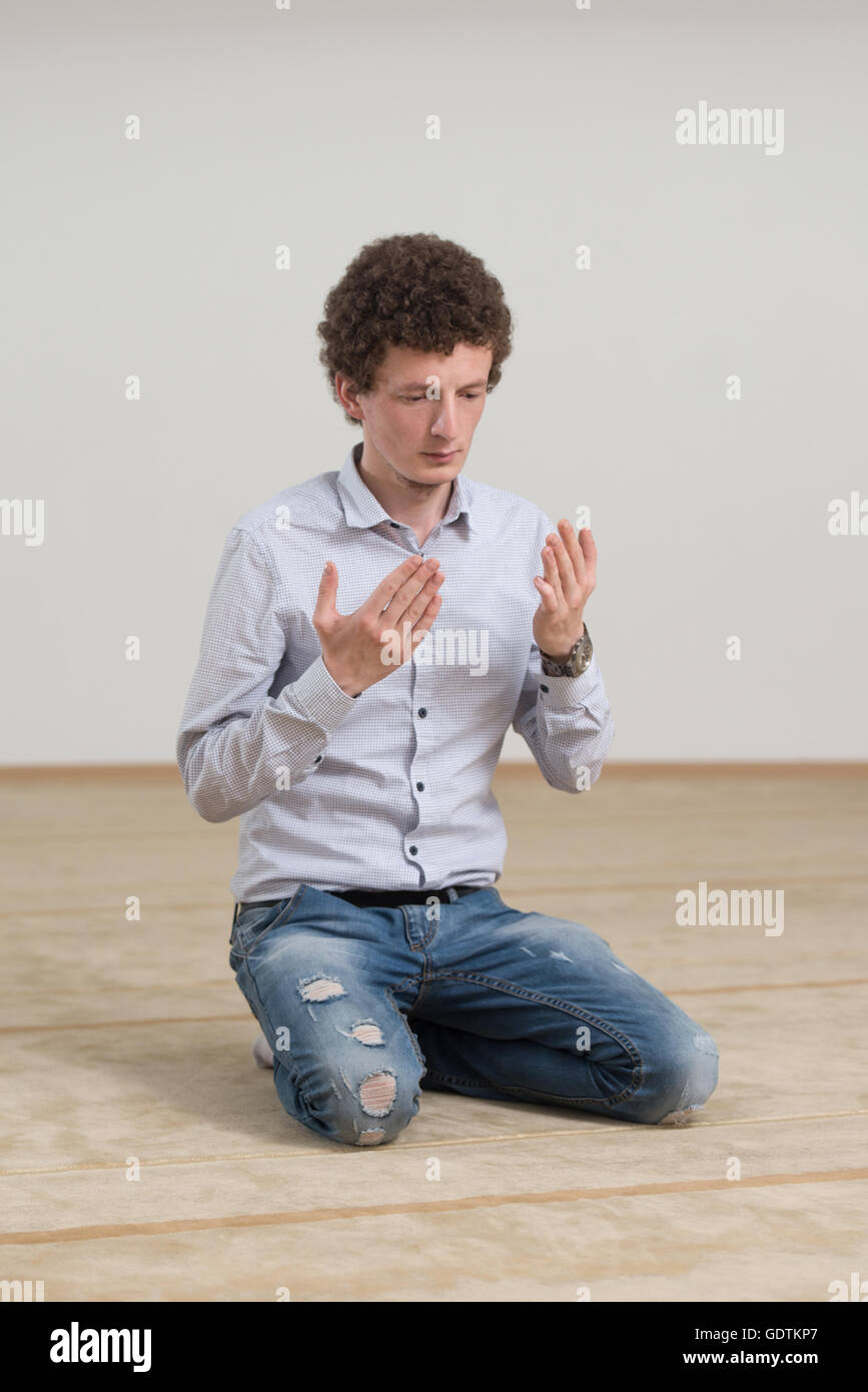 Humble White Muslim Man Is Praying In The Mosque - Afro Lock Hair Curly ...
