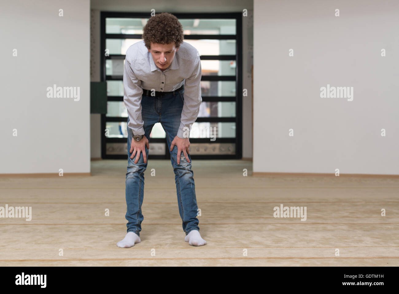 Humble White Muslim Man Is Praying In The Mosque - Afro Lock Hair Curly ...