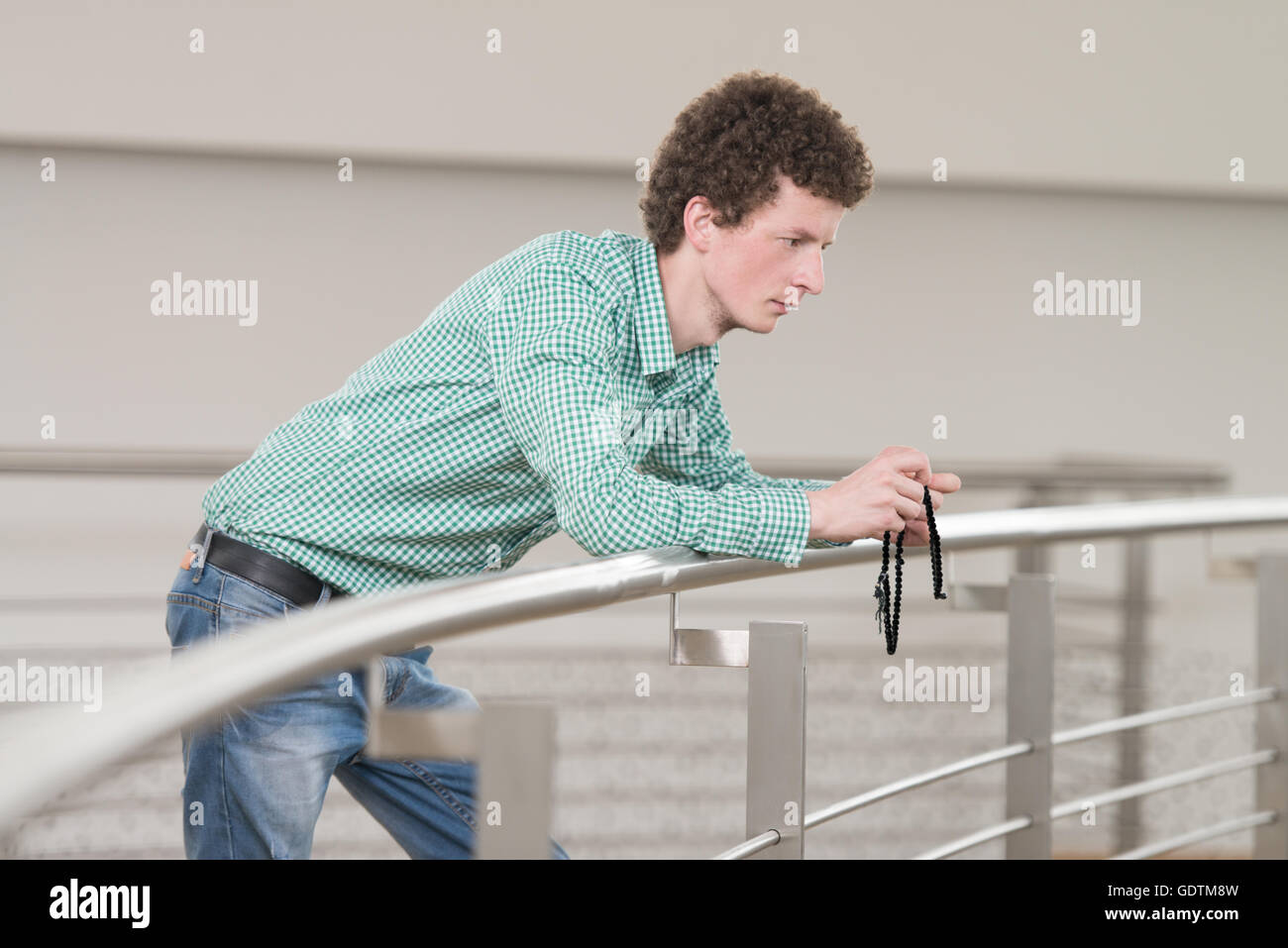 Portrait Of A White Muslim Man With Afro Lock Hair Curly Is Praying In ...