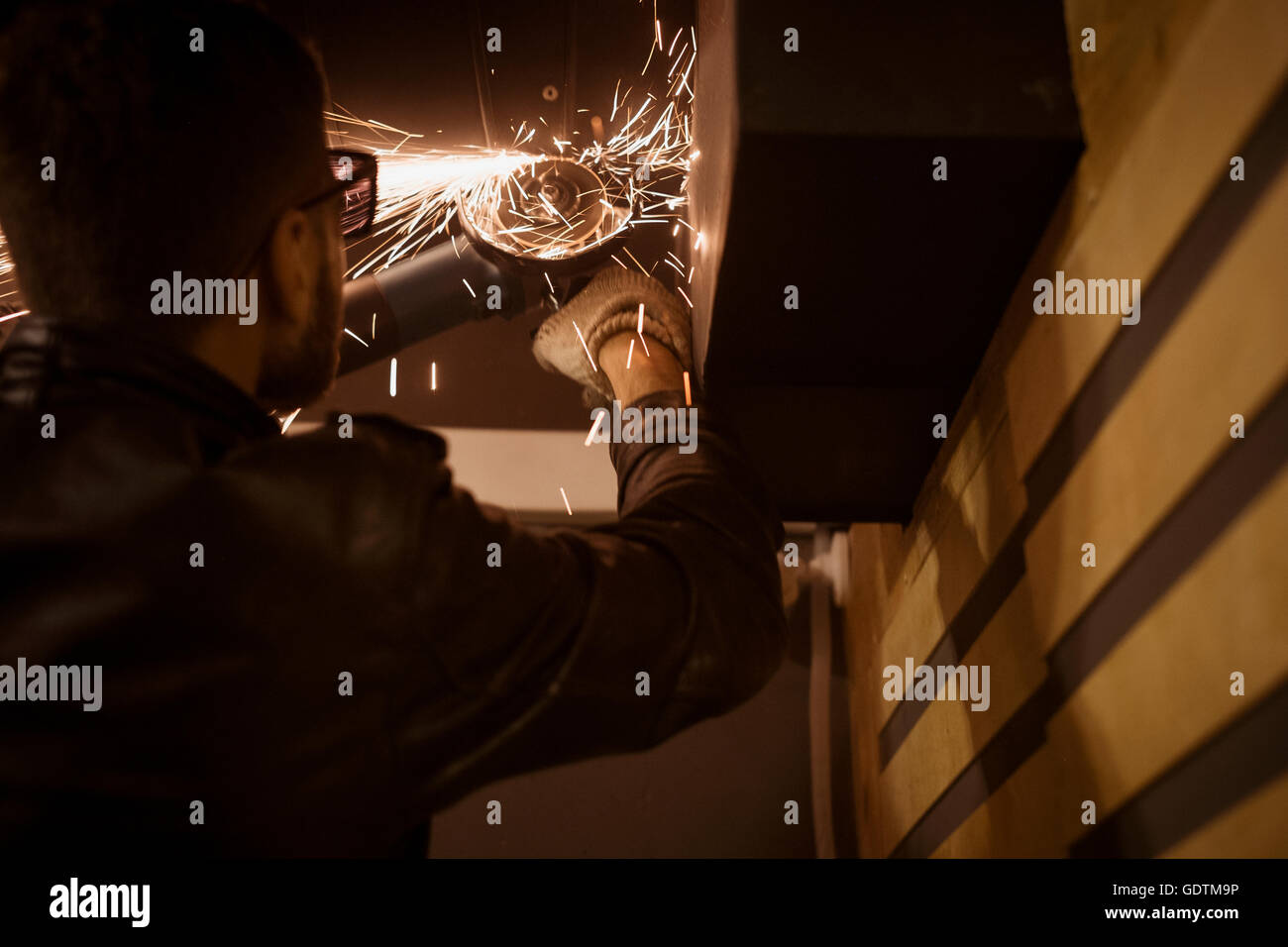 The repairman saws a metal pipe Stock Photo - Alamy
