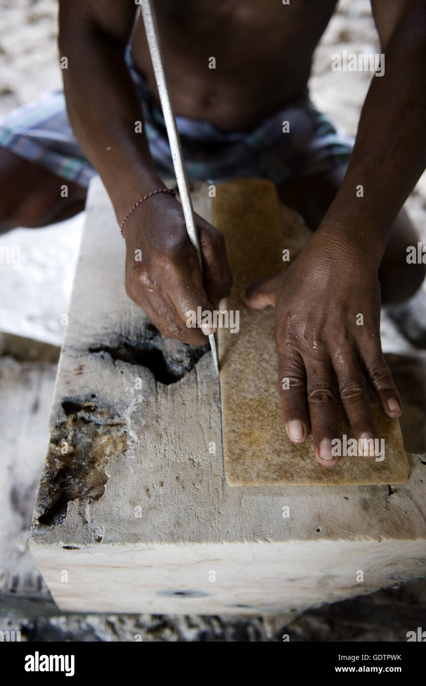Tombong rock is marked then sawn into standard sized building materials ...