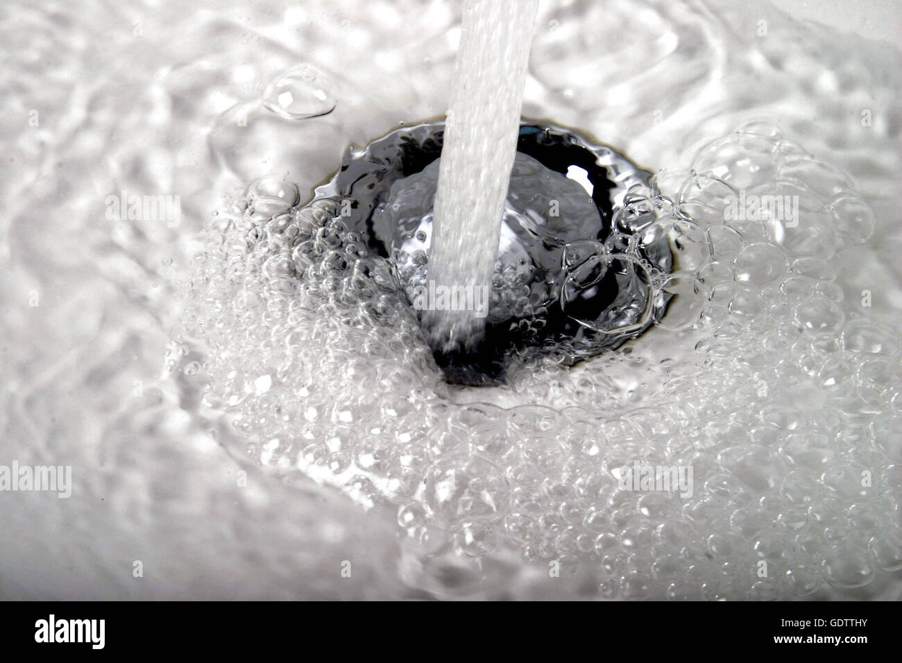 Sink with running water Stock Photo - Alamy