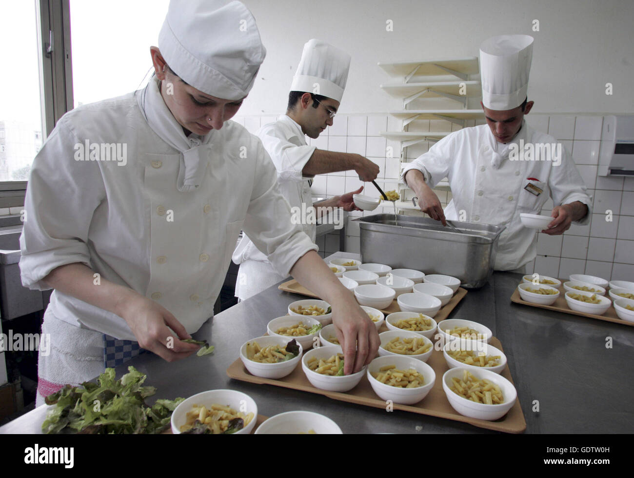 Apprentice chefs in a canteen kitchen Stock Photo - Alamy