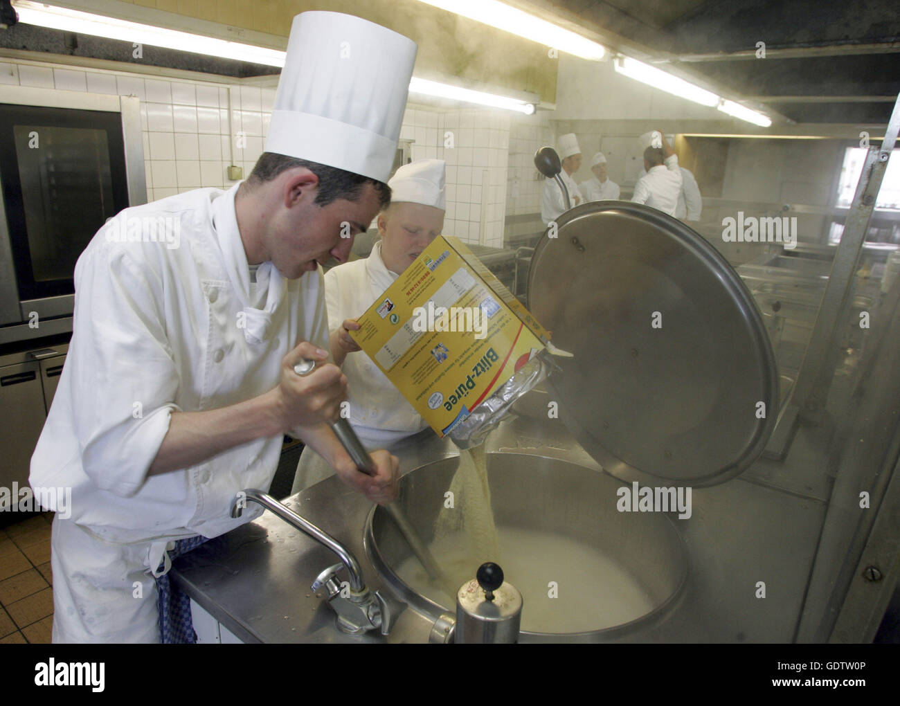 Apprentice chefs in a canteen kitchen Stock Photo - Alamy