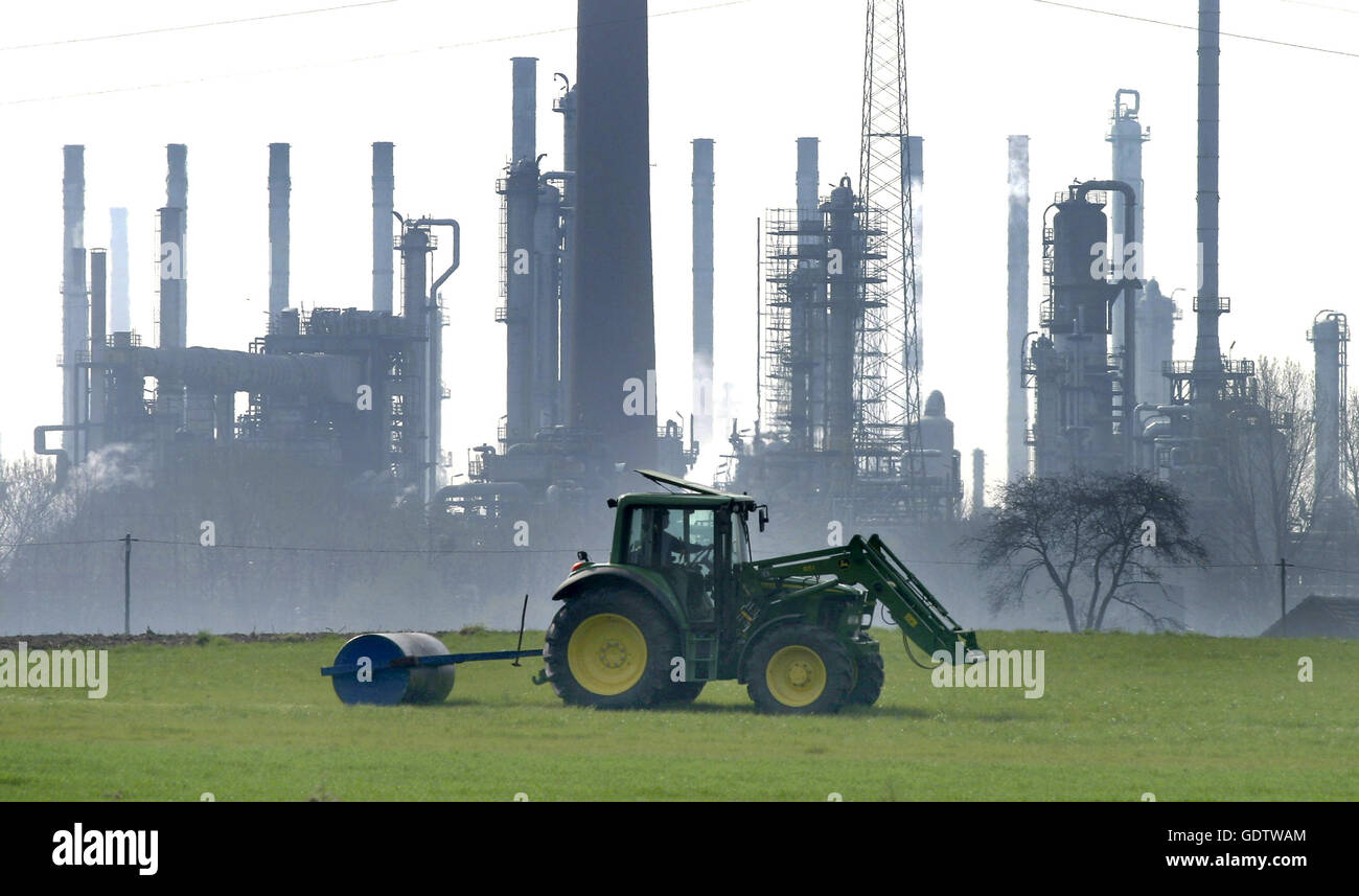 Tractor driving on a meadow Stock Photo - Alamy