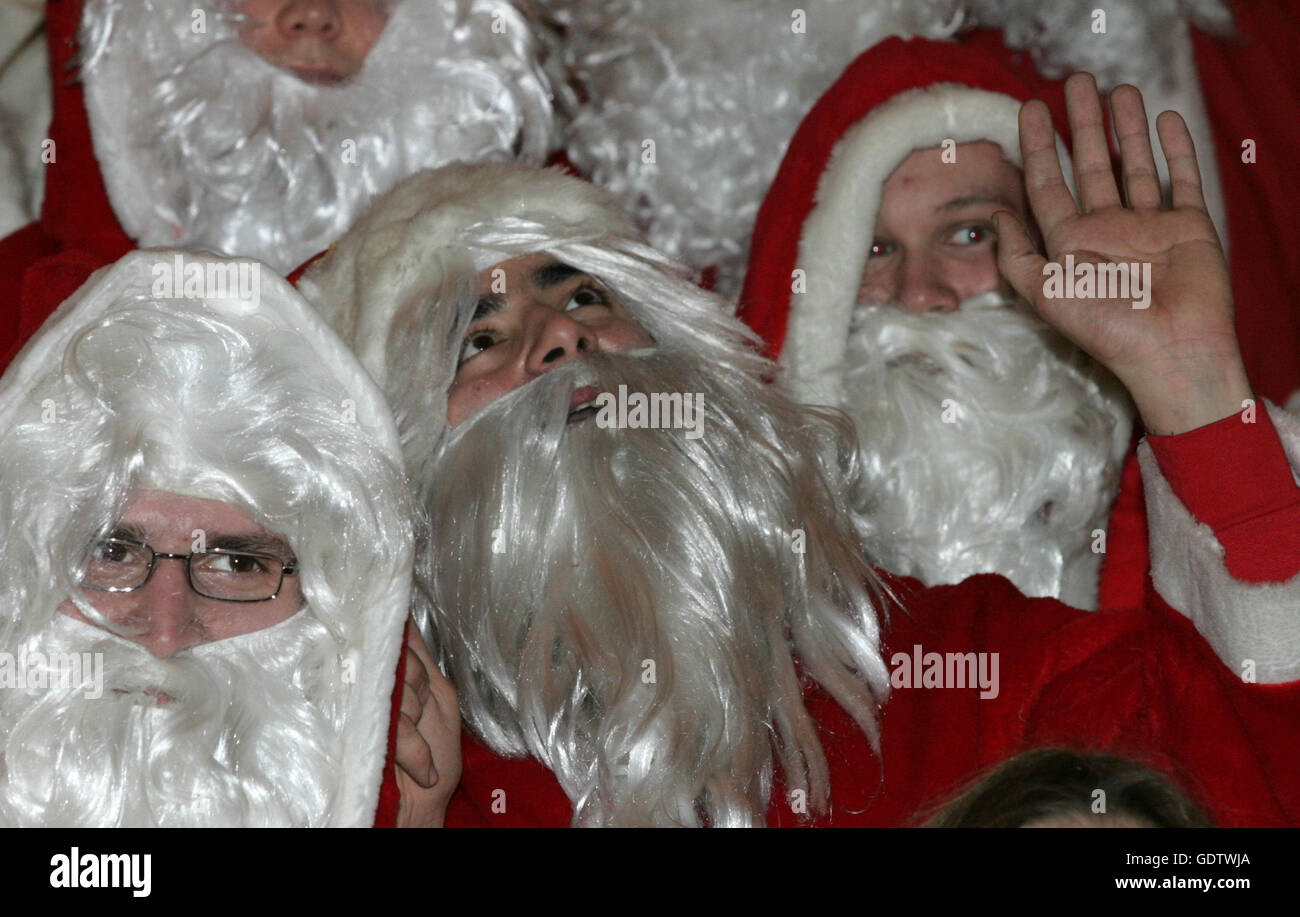 Santa and angel convention Stock Photo - Alamy