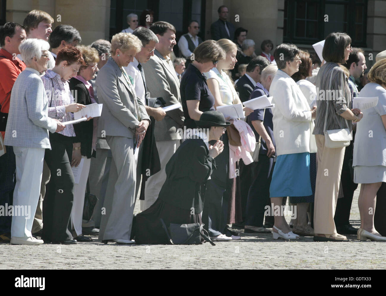 Christians pray during procession hi-res stock photography and images ...