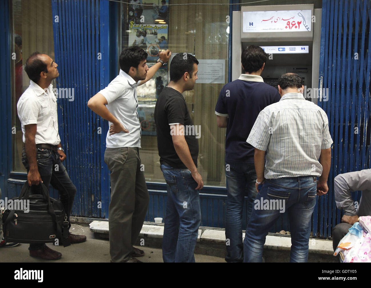 Waiting in line at cash machine hi-res stock photography and images - Alamy
