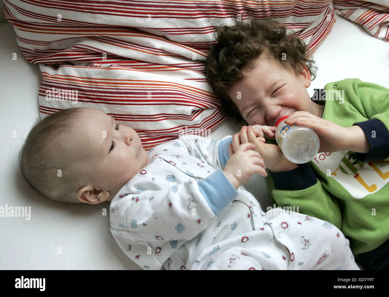 A little boy and a baby Stock Photo - Alamy