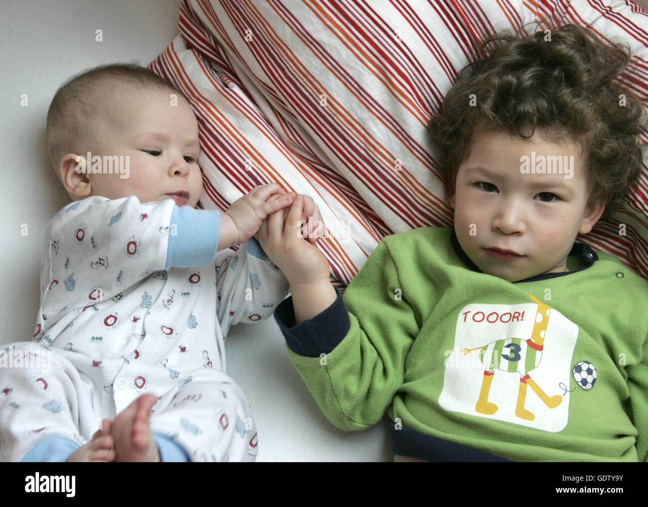 A little boy and a baby Stock Photo - Alamy