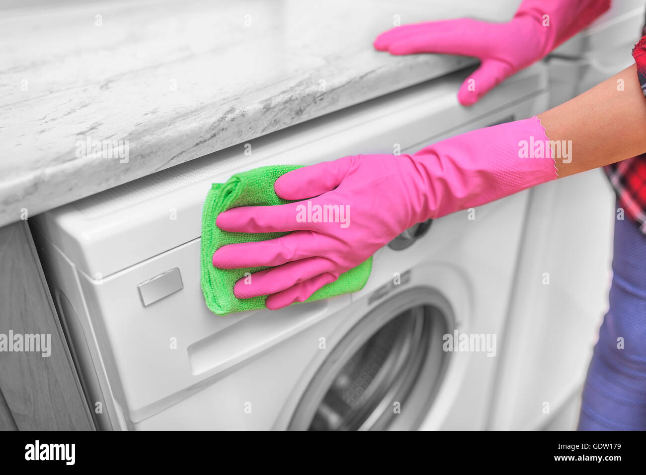 Female hands in gloves washing washing machine. Close-up Stock Photo ...