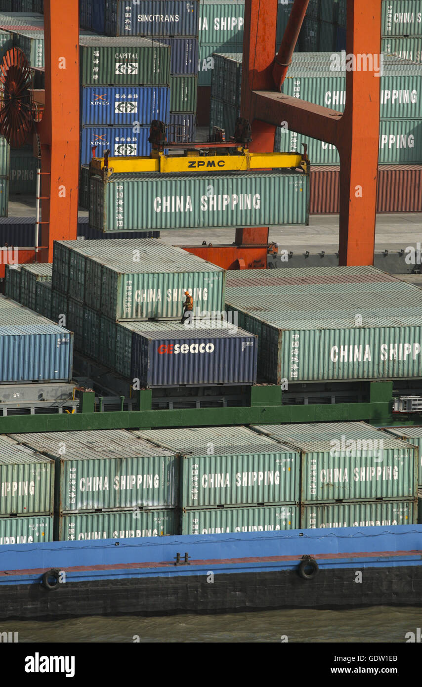 A container is load on a ship on Huangpu river in Shanghai 25 April ...