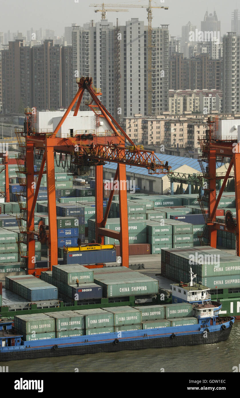 A container is load on a ship on Huangpu river in Shanghai 25 April ...