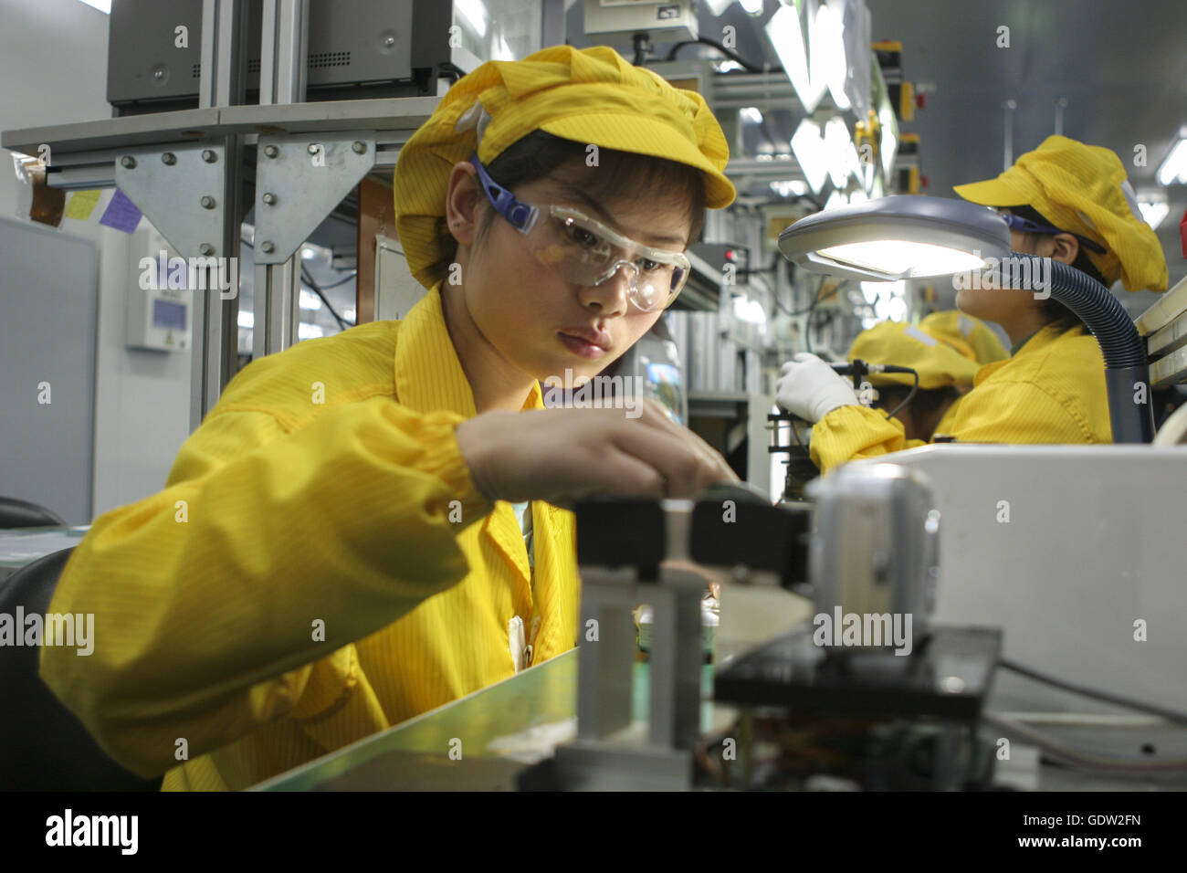 Factory workers assemble kodak digital hi-res stock photography and ...