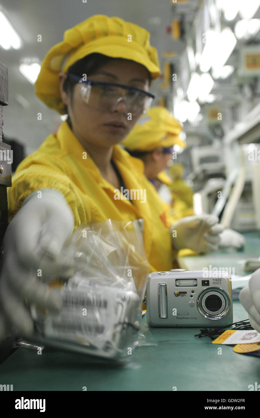 Factory workers assemble kodak digital hi-res stock photography and ...