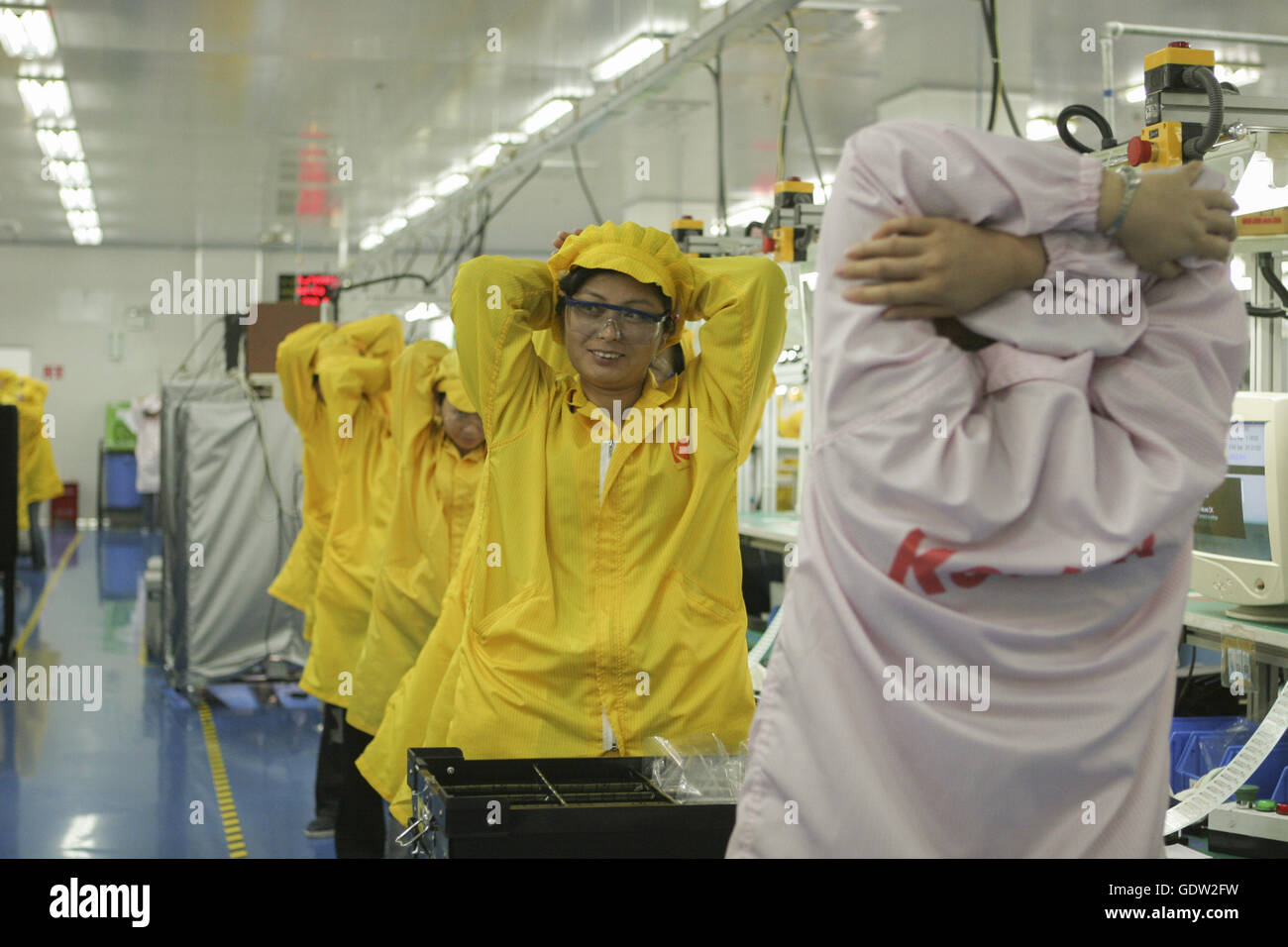 Factory workers do stretch at a Kodak digital camera production line in ...