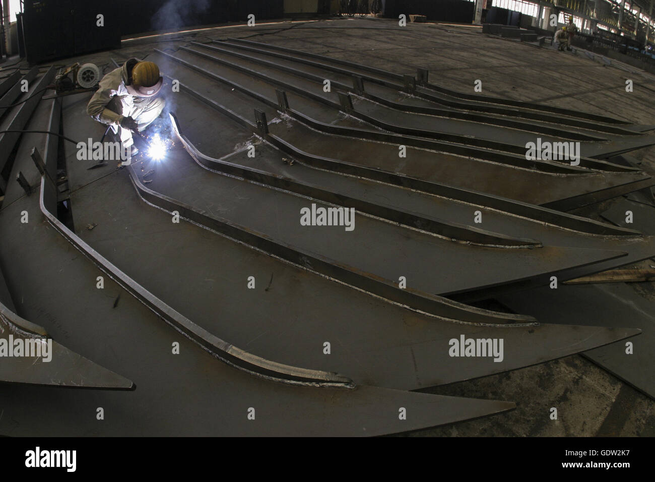 Workers weld steel plates March 7 Stock Photo - Alamy