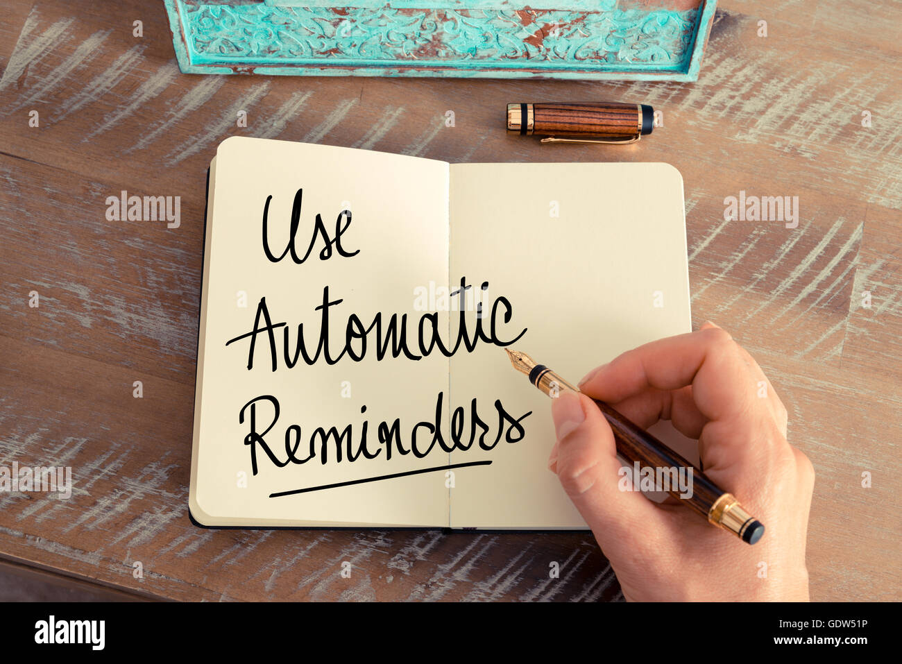 Handwritten text Use Automatic Reminders as concept image. Retro effect ...