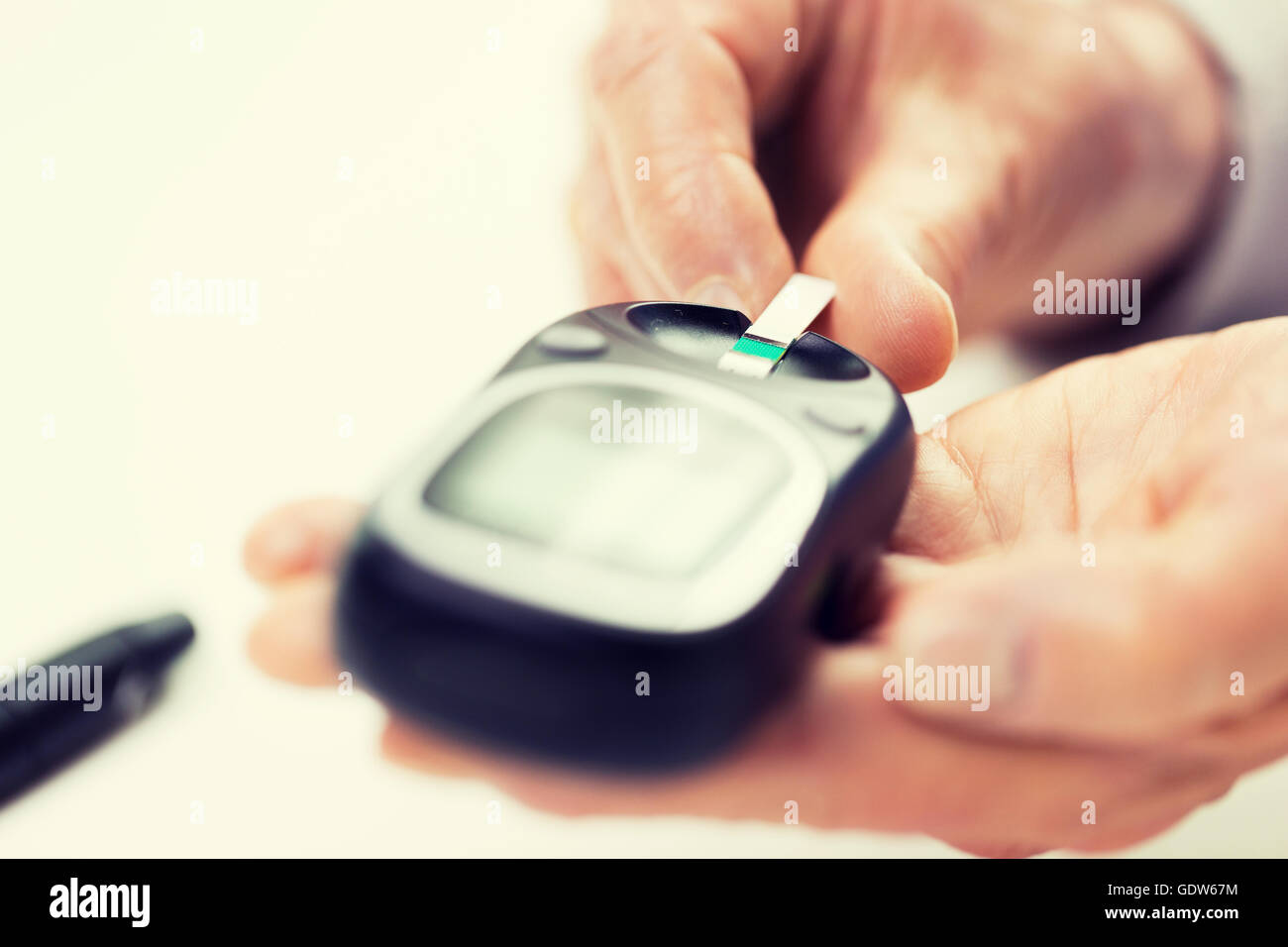 senior woman with glucometer checking blood sugar Stock Photo - Alamy
