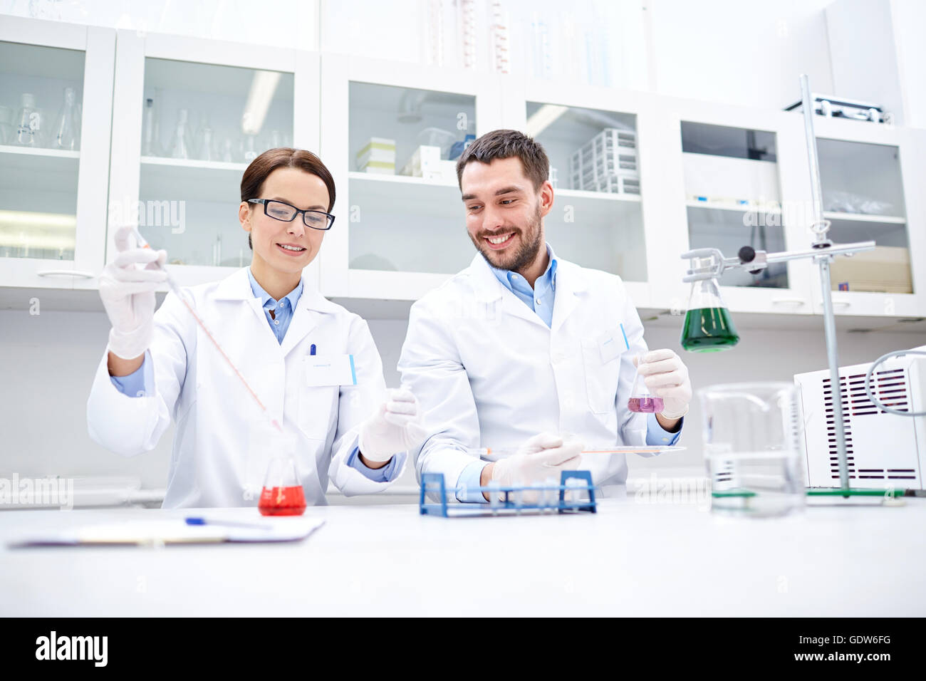 young scientists making test or research in lab Stock Photo - Alamy