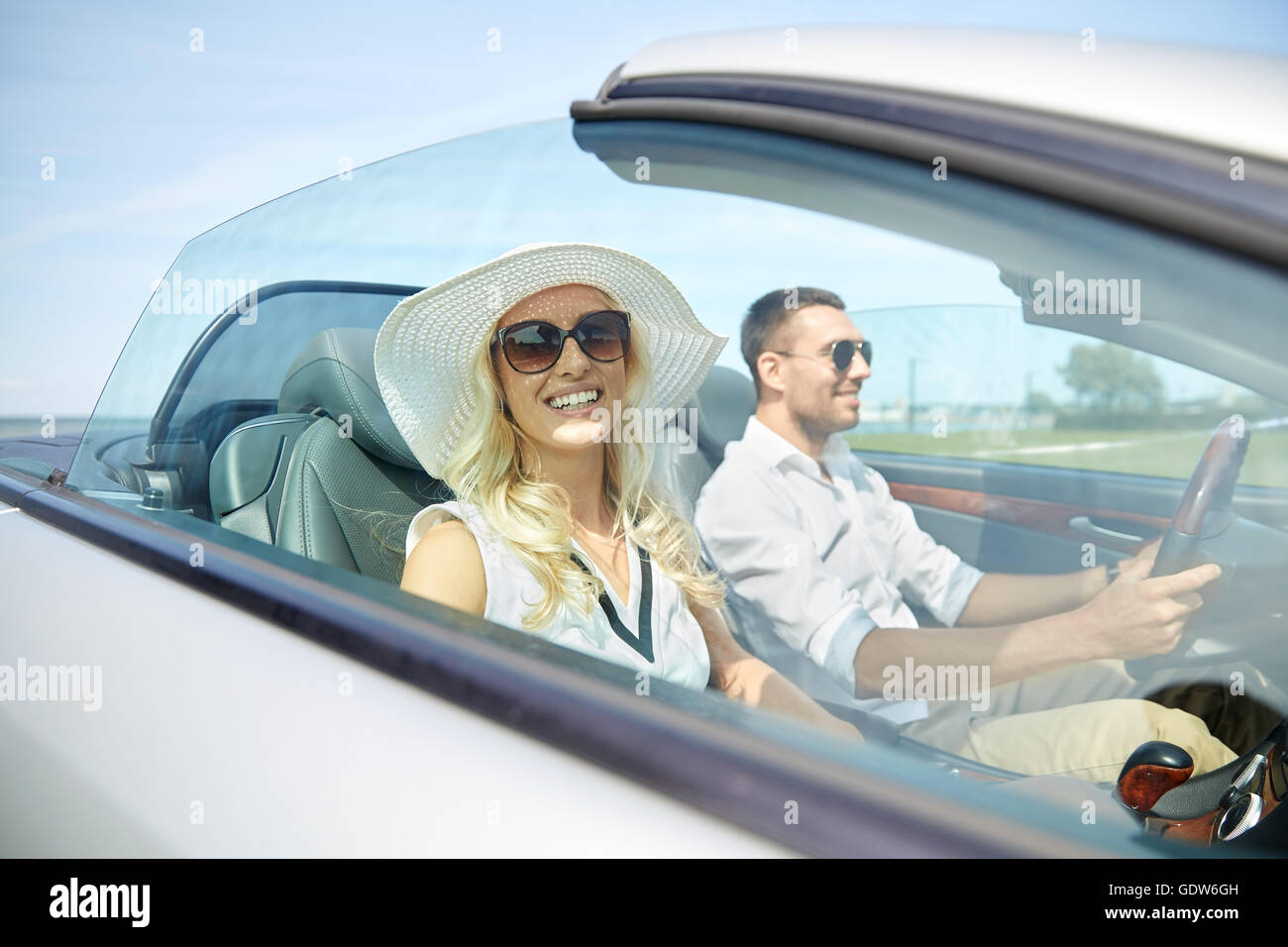 happy man and woman driving in cabriolet car Stock Photo - Alamy