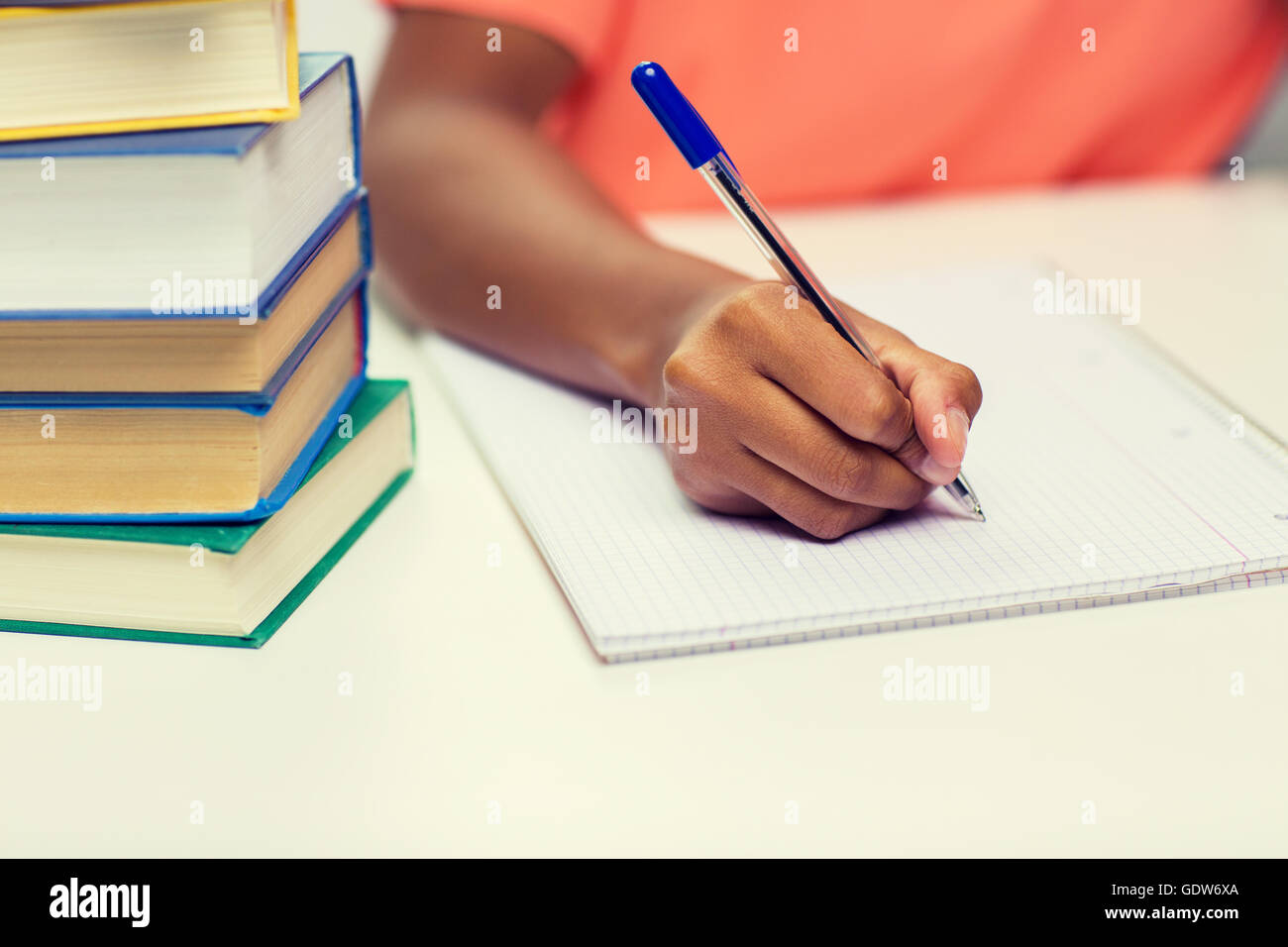 close up of african woman hand writing to notebook Stock Photo - Alamy