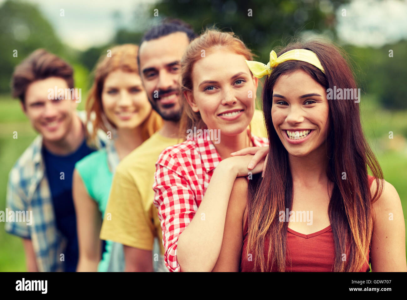 group of smiling friends outdoors Stock Photo - Alamy