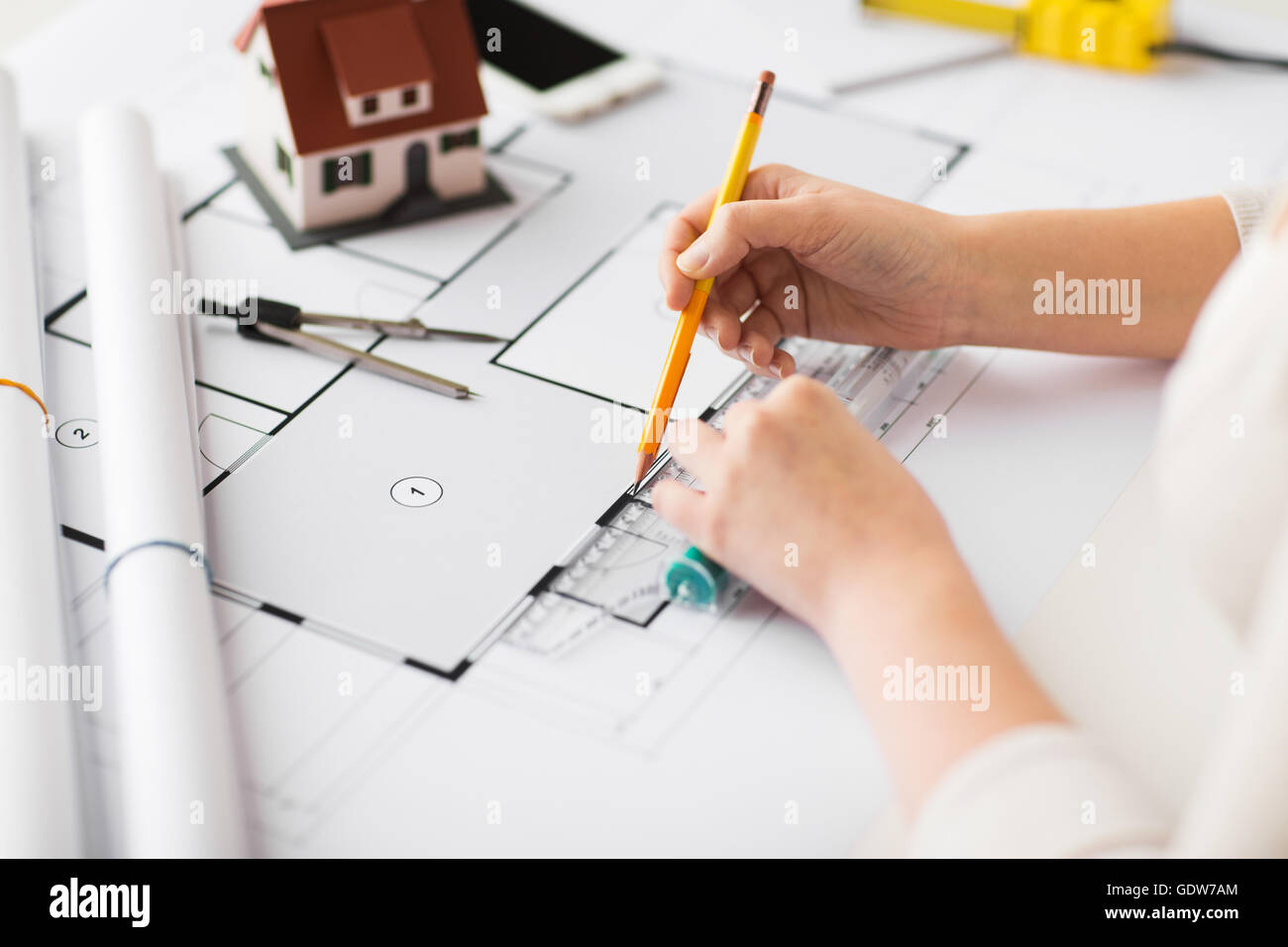 close up of hands with compass measuring blueprint Stock Photo - Alamy