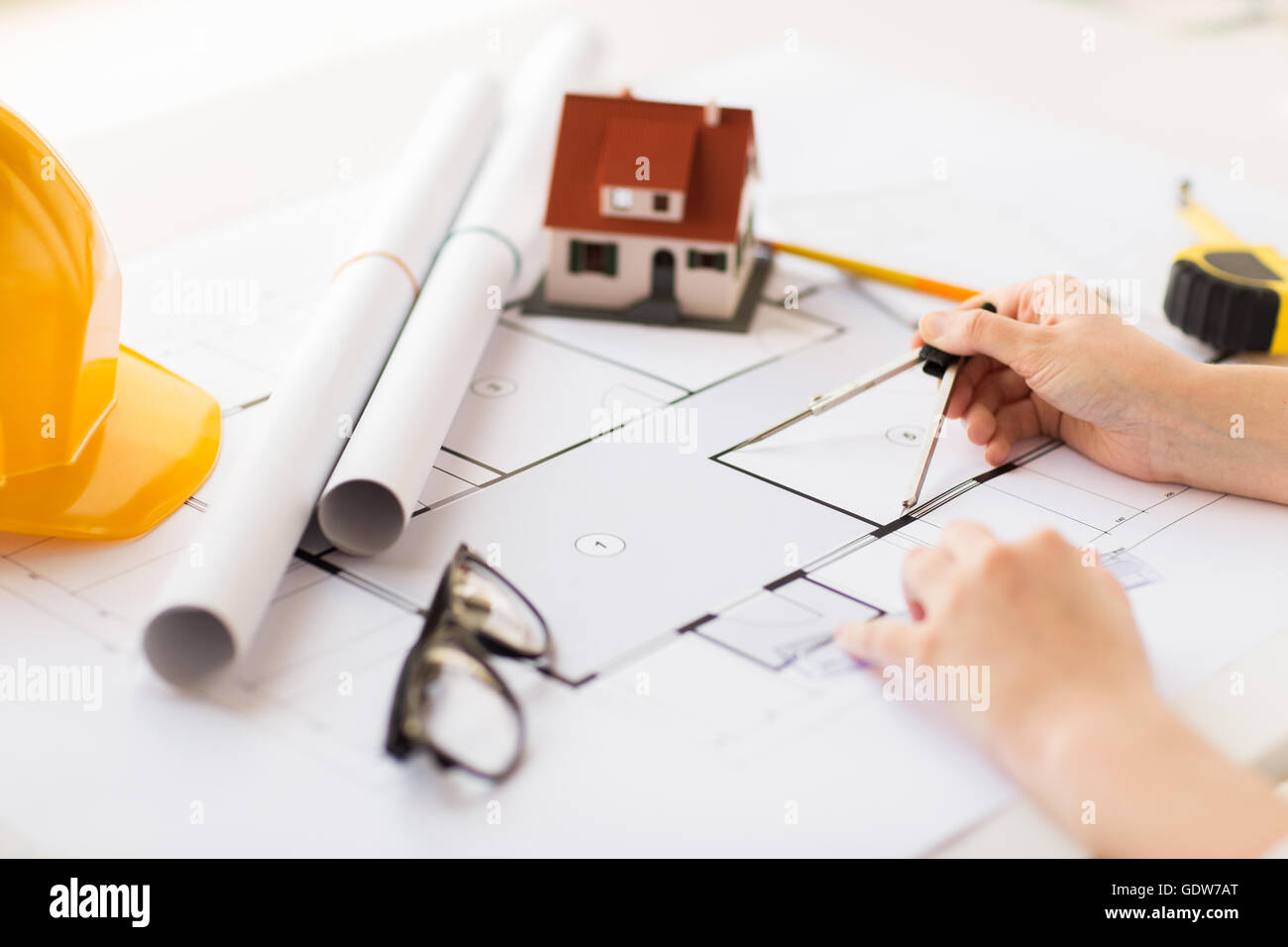 close up of hands with compass measuring blueprint Stock Photo - Alamy