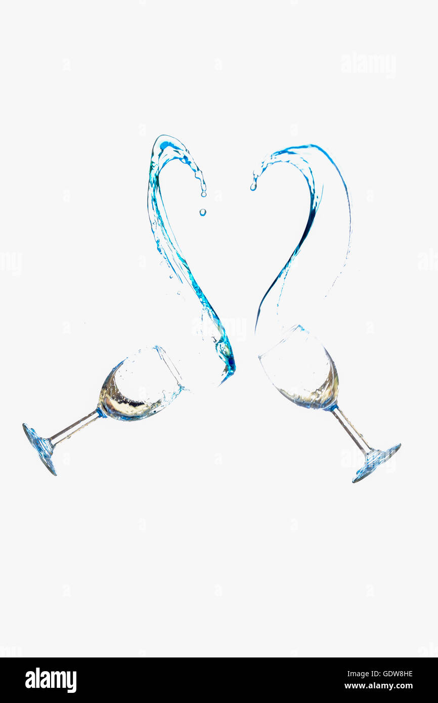 Splashing drinks form the shape of a heart Stock Photo - Alamy