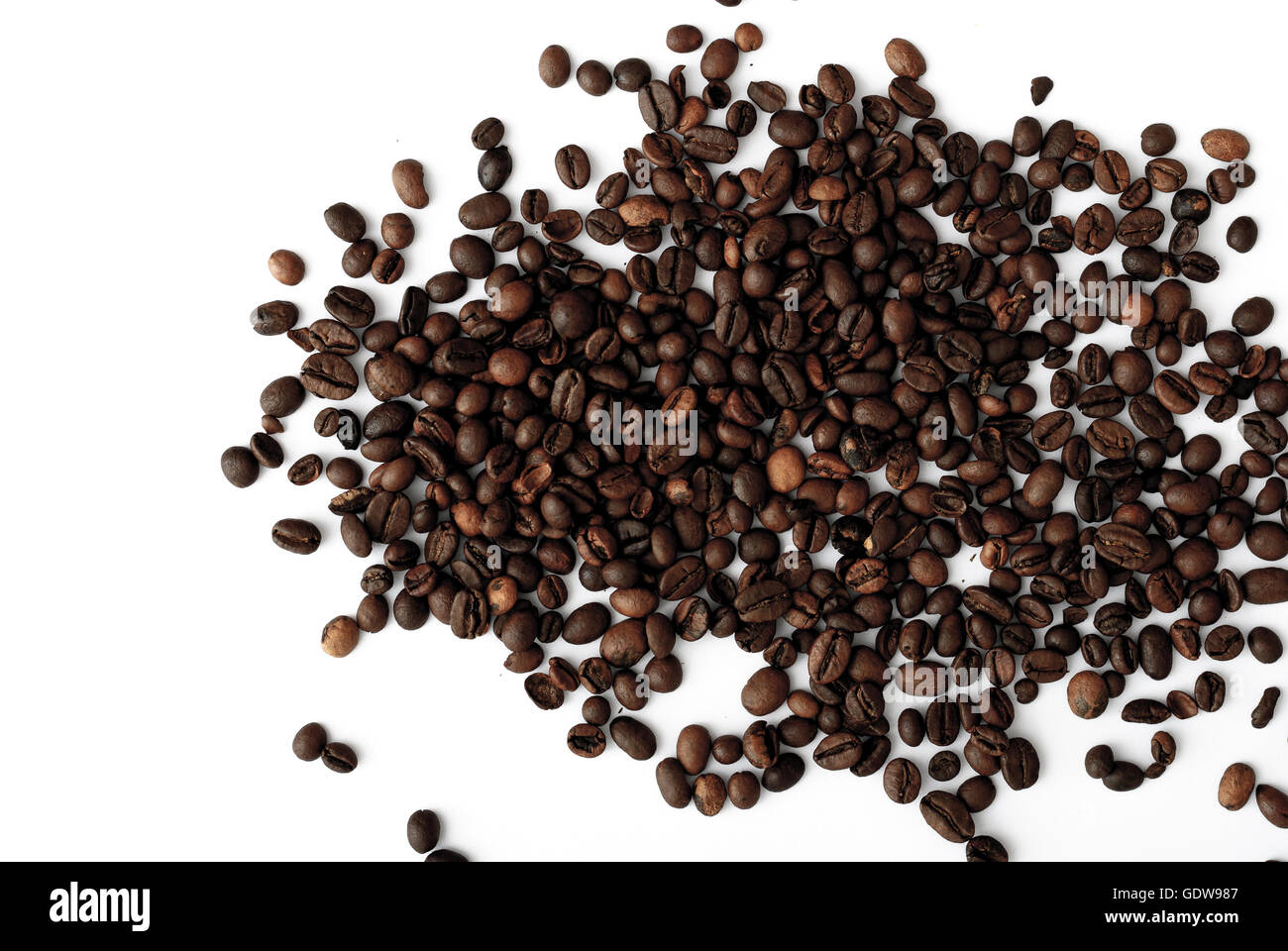 the coffee grains which are beautifully spread out on a white ...