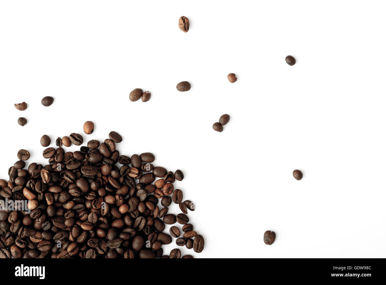 the coffee grains which are beautifully spread out on a white ...