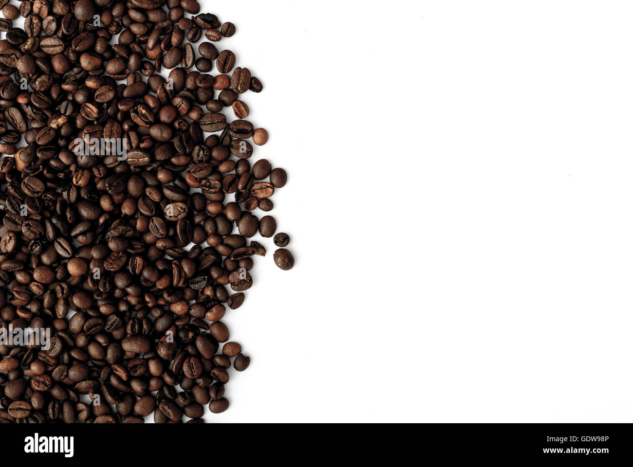 the coffee grains which are beautifully spread out on a white ...