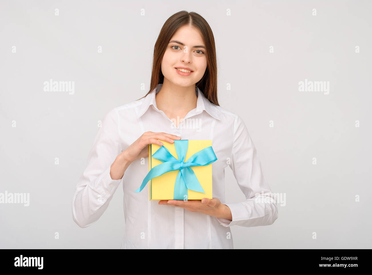 Present. woman in black dress holding gift Stock Photo - Alamy