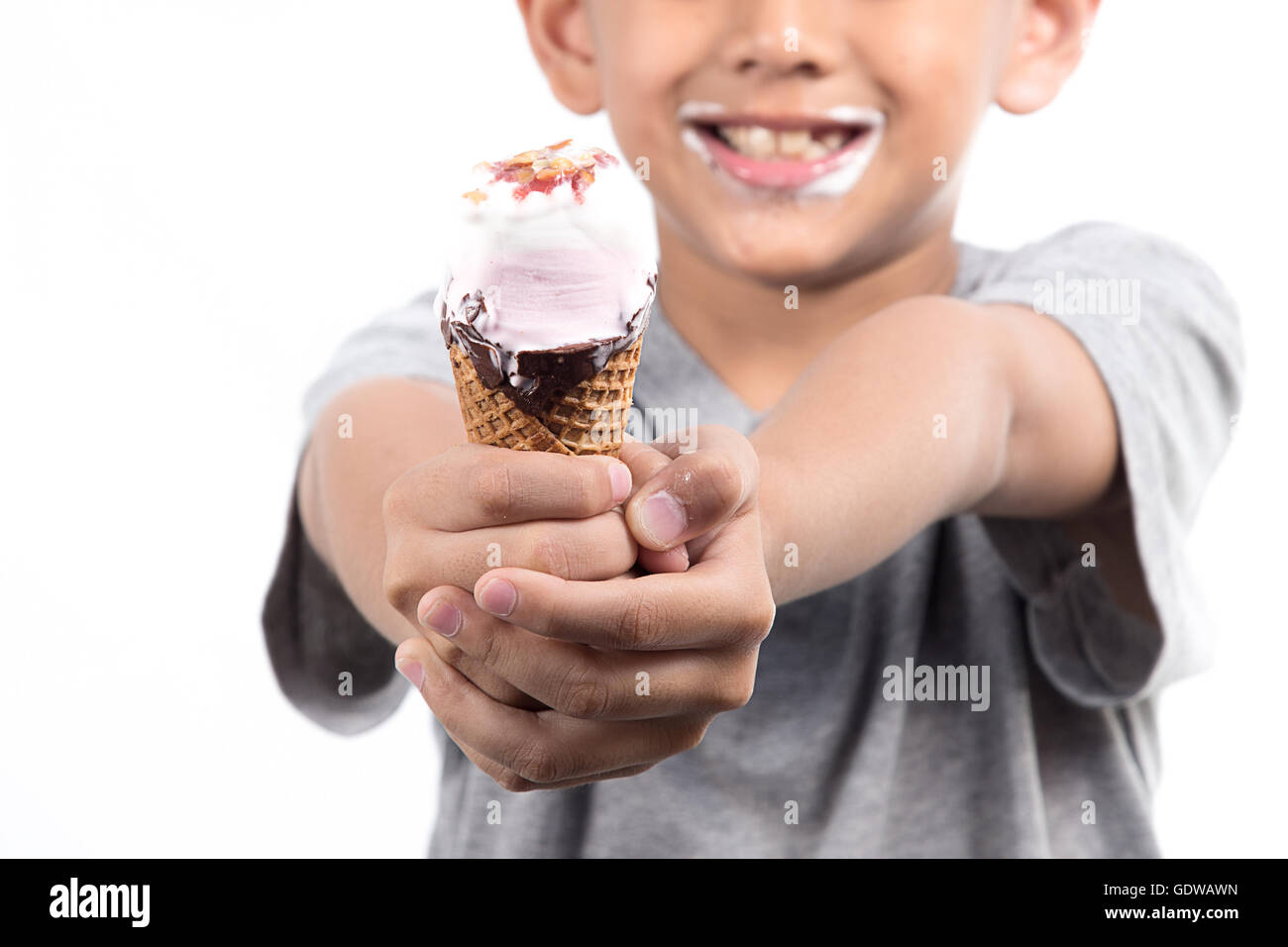 Young boy enjoying ice cream Stock Photo - Alamy